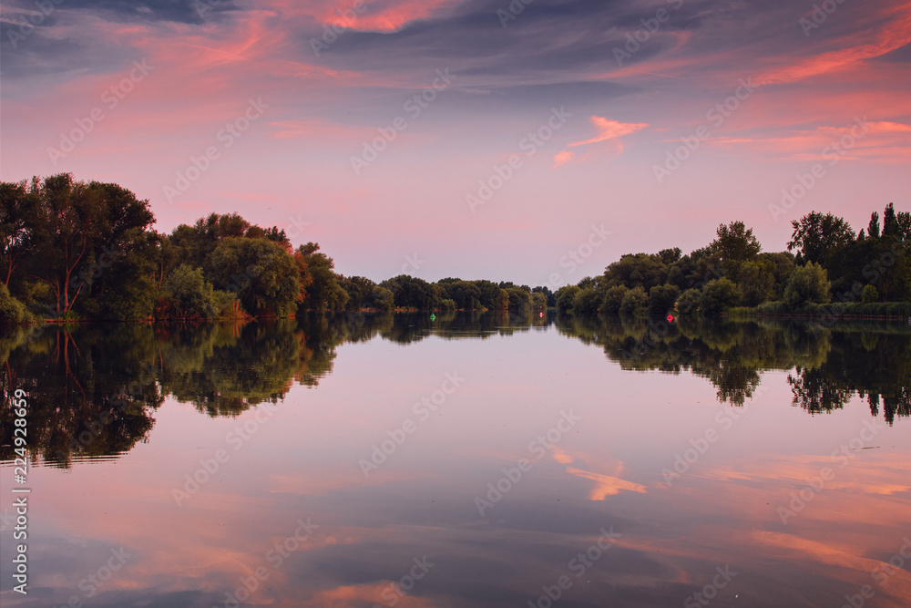 Reflection of a lake creating perfect symmetry with abstract shapes of ...