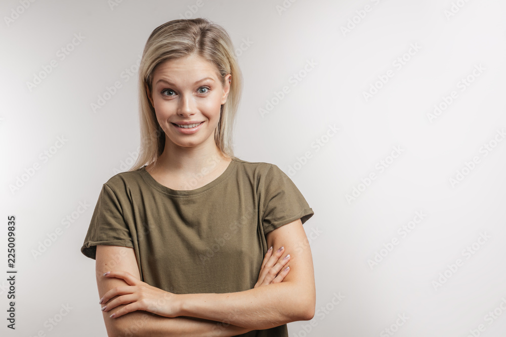 Studio portrait of attractive surprised astonished blonde woman with ...