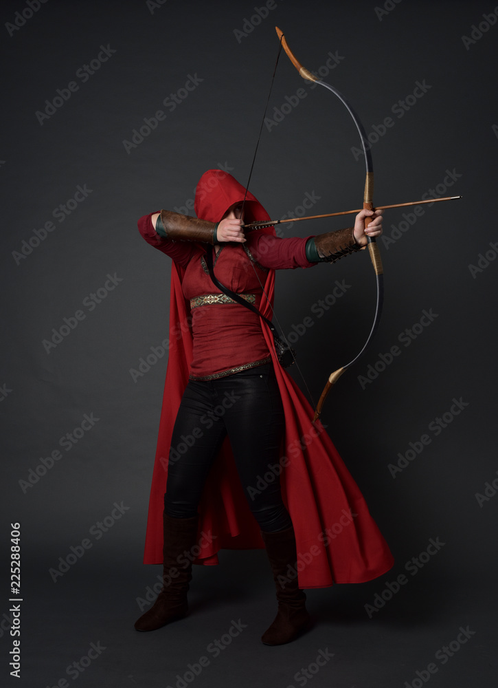 full length portrait of brunette girl wearing red medieval costume and ...