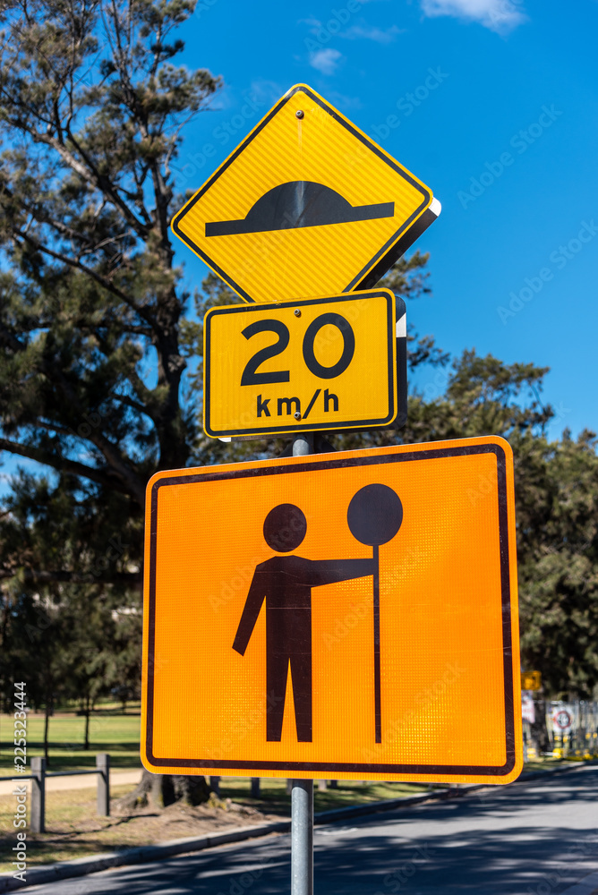 Australian road signs "speed bump" "20km/h speed limit" and "person ...