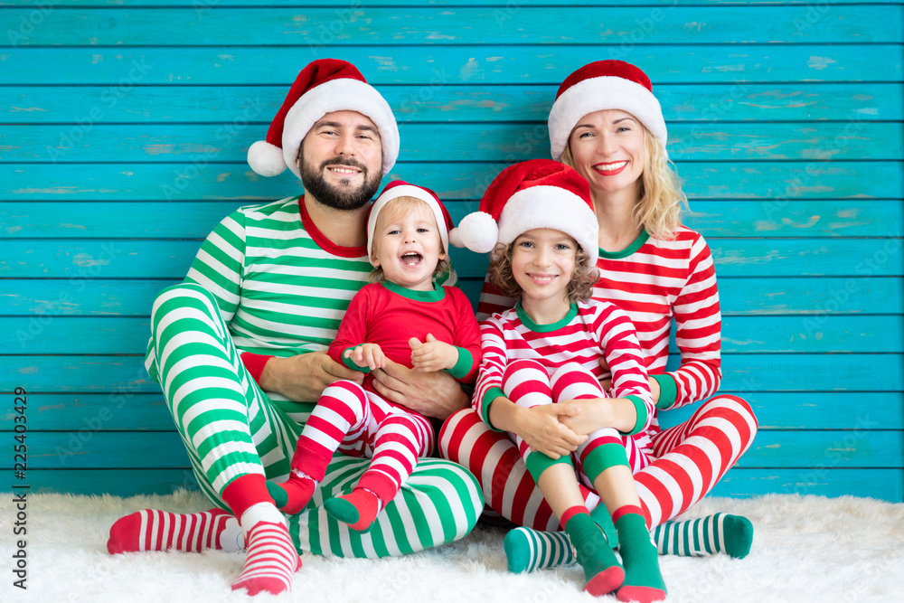 Stock-Foto „Happy family having fun at Christmas time“ | Adobe Stock