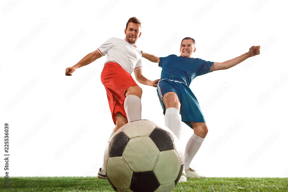 Football players tackling for the ball over white background ...