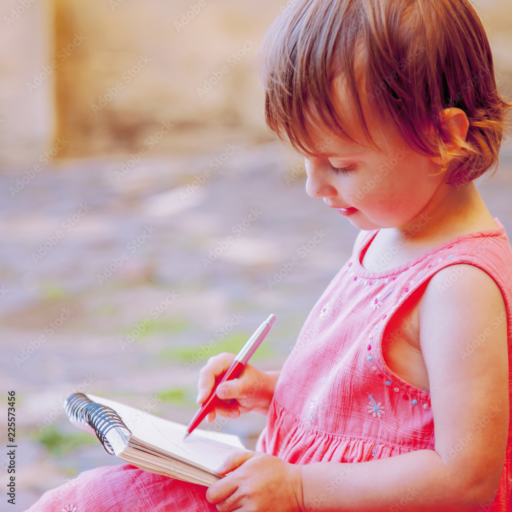 Little beautiful child girl writing a letter. (Education, studies ...
