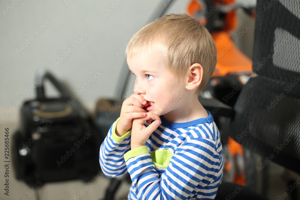child bites nails. bad children's habits. the little boy is nervous ...