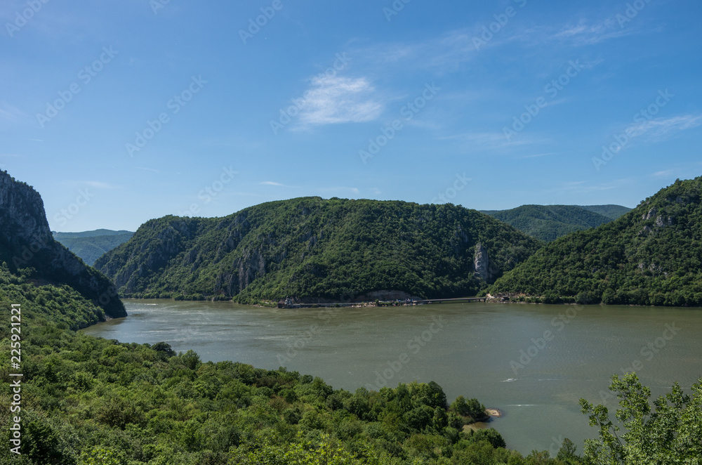 Panarama of Danube river with Decebalus Head sculpted in rock, Danube ...