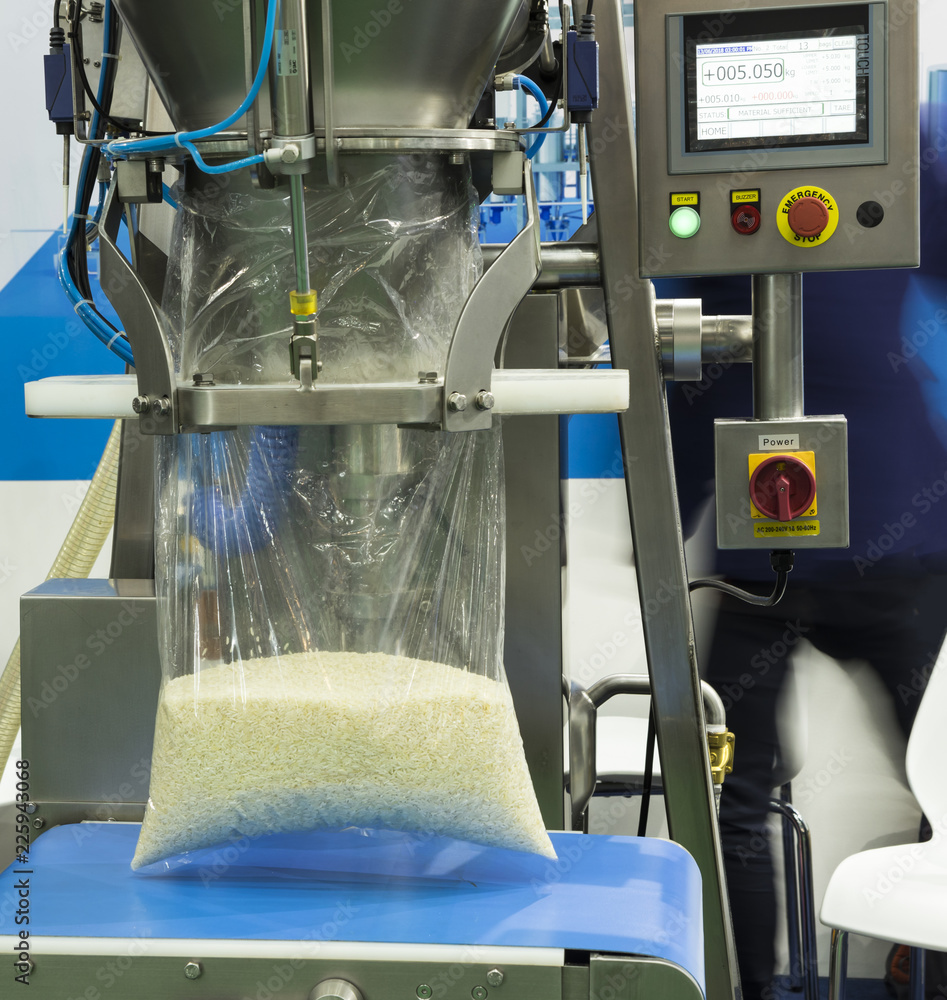 Rice fill into plastic by packing machine Stock Photo | Adobe Stock