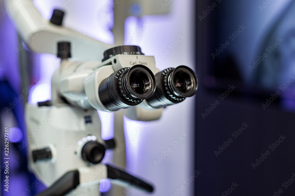 Dental microscope on the background of modern dentistry. Medical ...