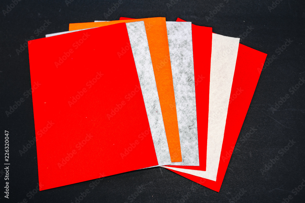 Red colored bright felt textile material. Samples of soft felt. Craft ...