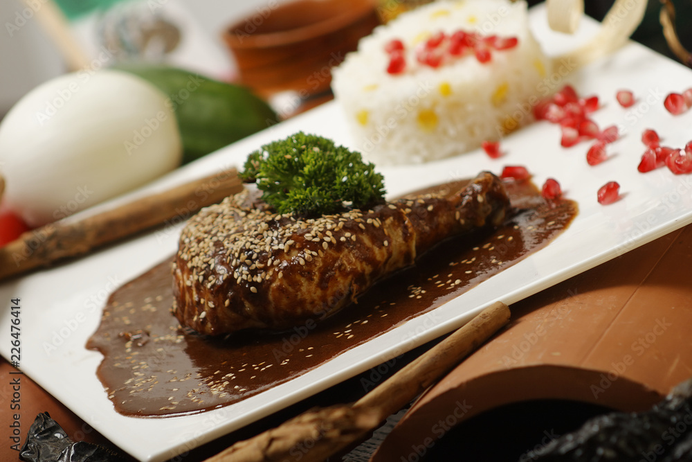 Photo Stock Mole poblano with rice and sesame seed. This is the best ...