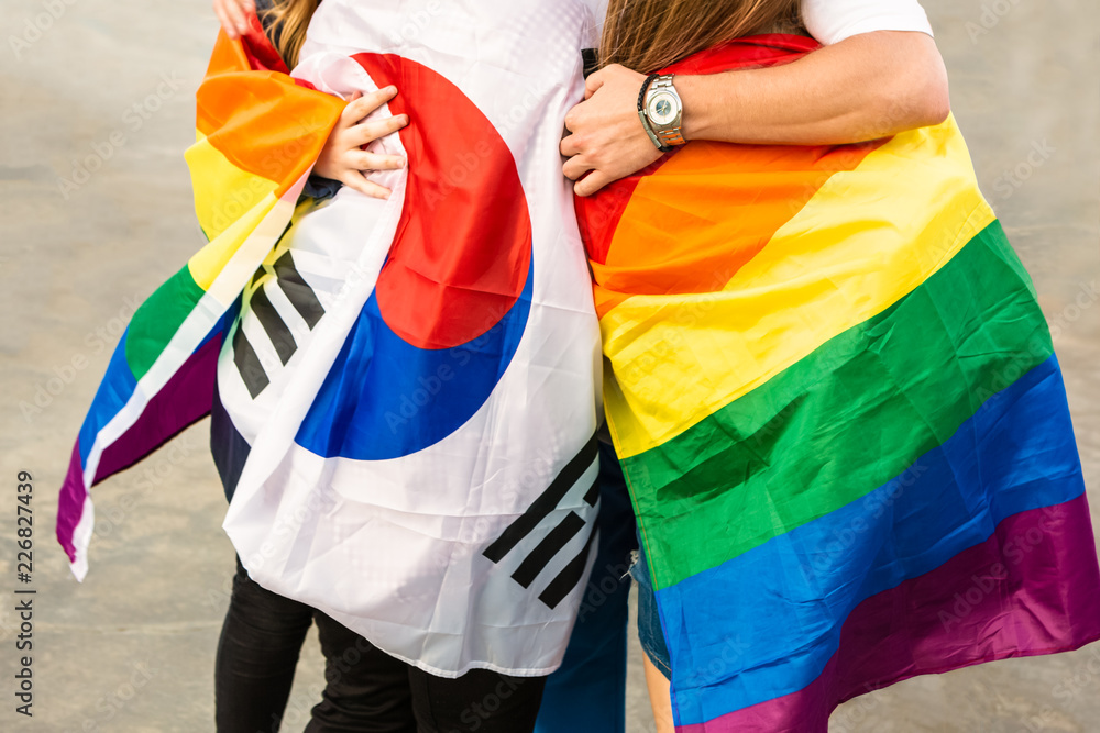LGBT Community Holding Up Rainbow Flags Proudly To Support Equality And ...