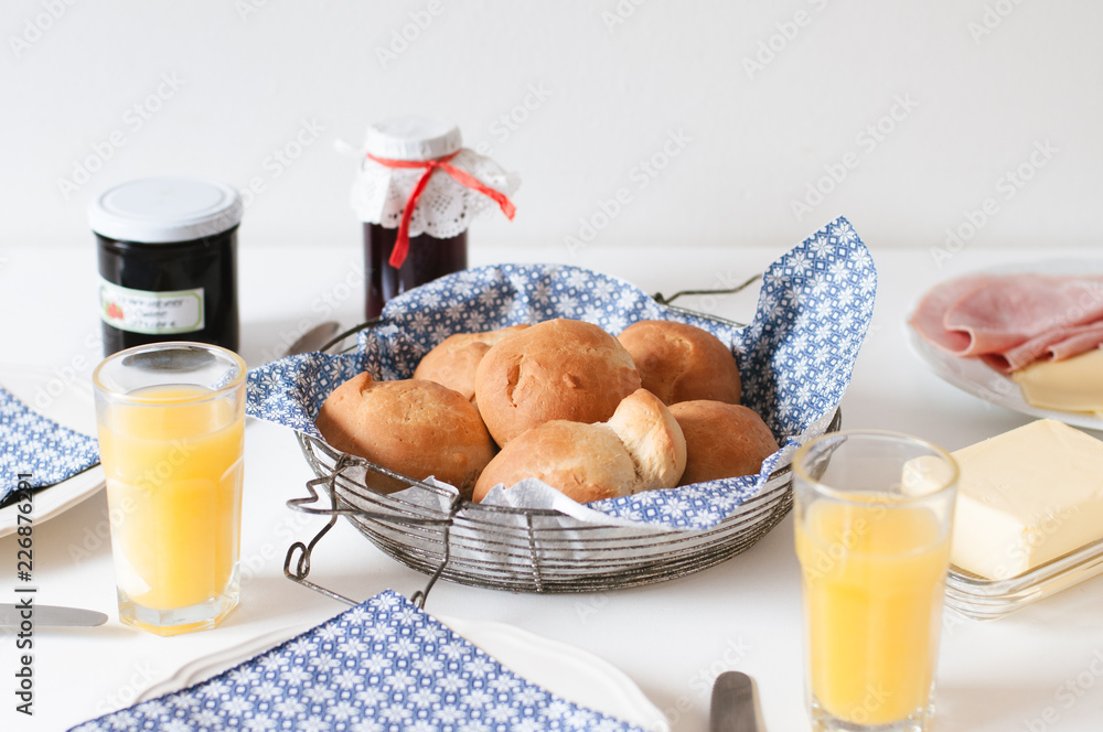 Typical German or Austrian breakfast table with Kaiser or Vienna rolls ...