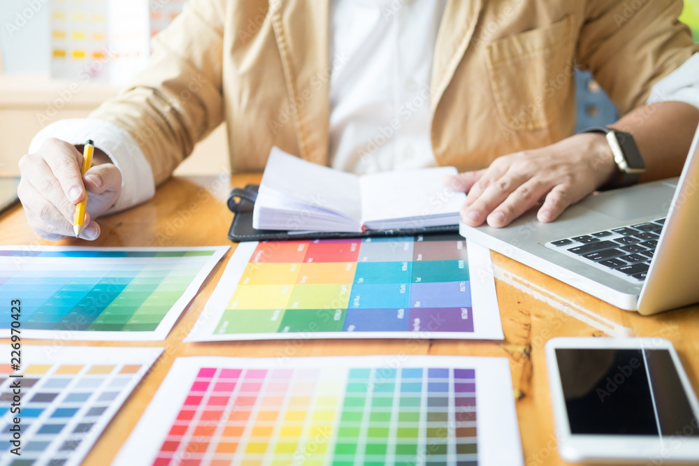 Creative Graphic designer at work. Color swatch samples pantone palette ...