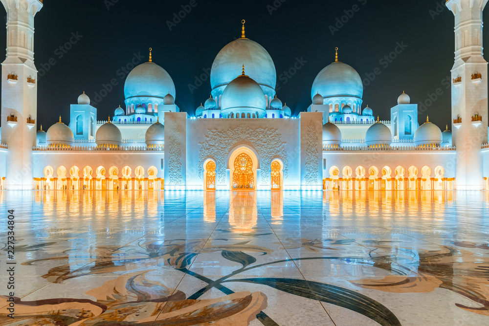 Sheikh Zayed Grand Mosque in Abu Dhabi with two minarets lighting at ...