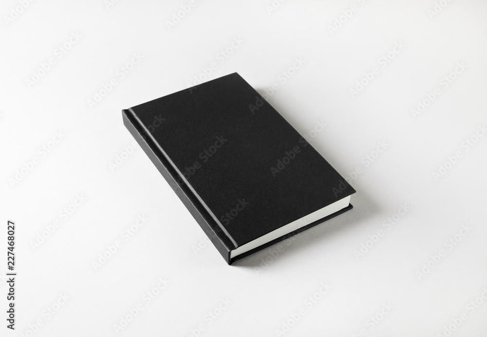 Blank black book cover on white paper background. Stock Photo | Adobe Stock