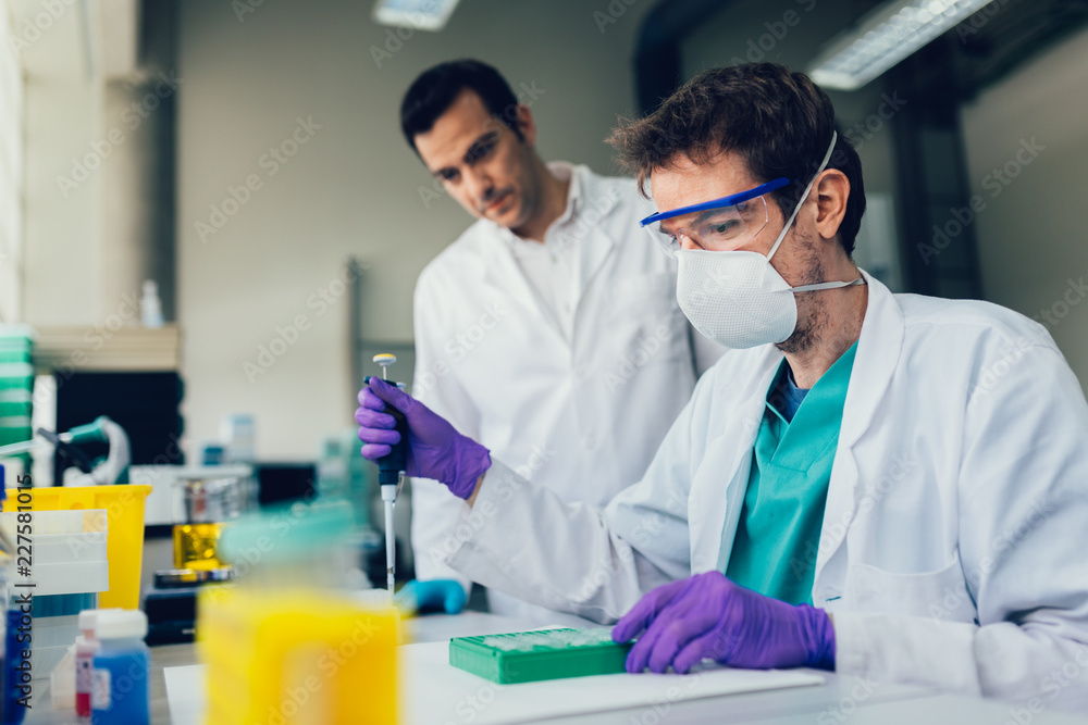 Biologist Working in a Professional Laboratory Stock Photo | Adobe Stock