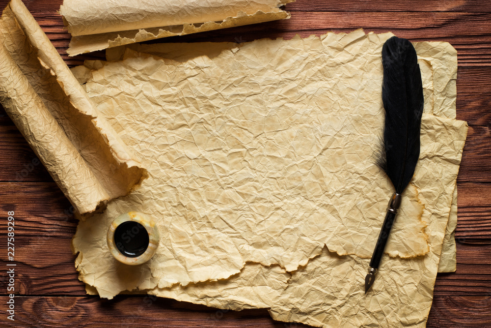 black quill pen and ink on old paper background Stock Photo | Adobe Stock