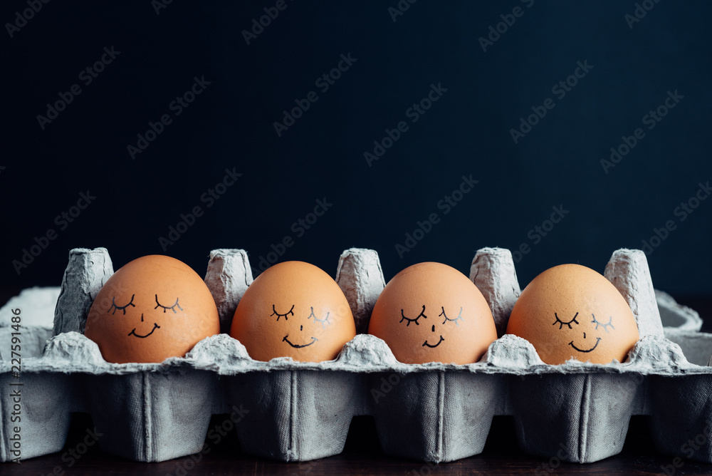 Cute sleeping eggs in a crate Stock Photo | Adobe Stock