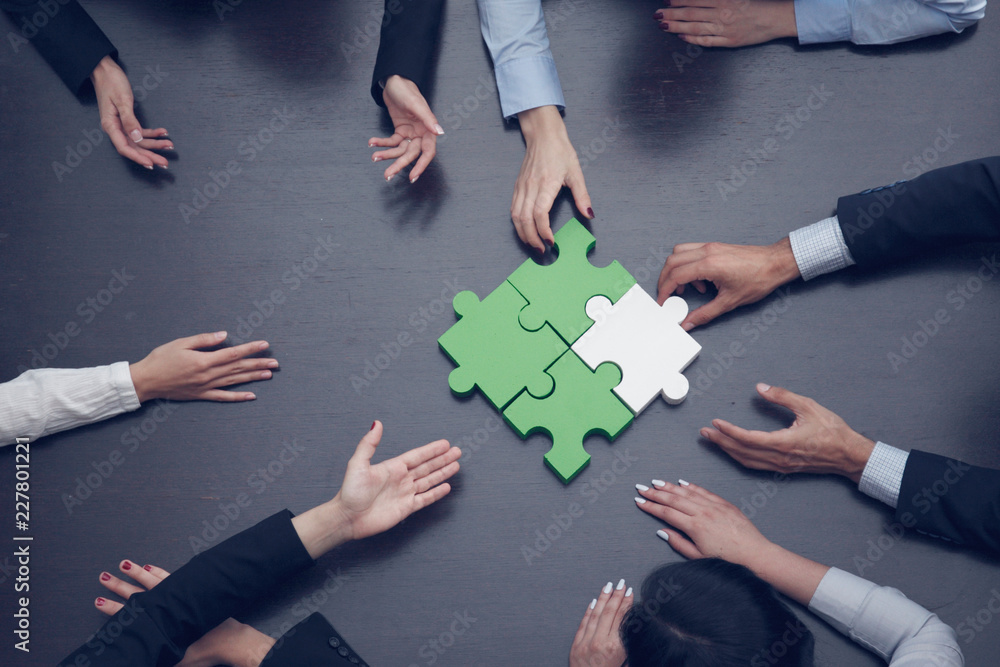 Business people assembling puzzle Stock Photo | Adobe Stock