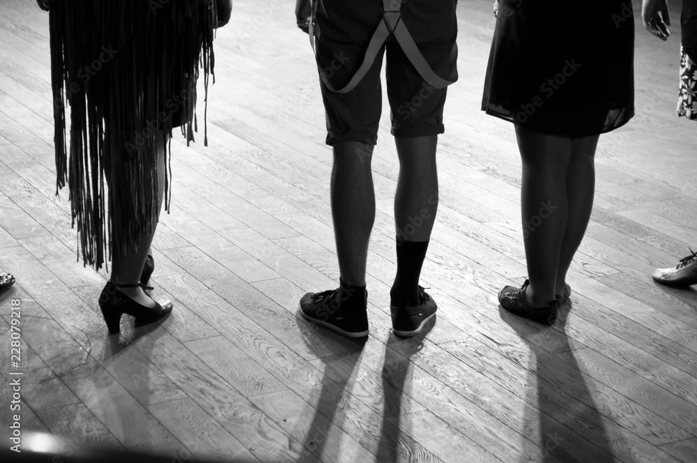 Legs of actors and dancers in costumes standing on stage under the ...