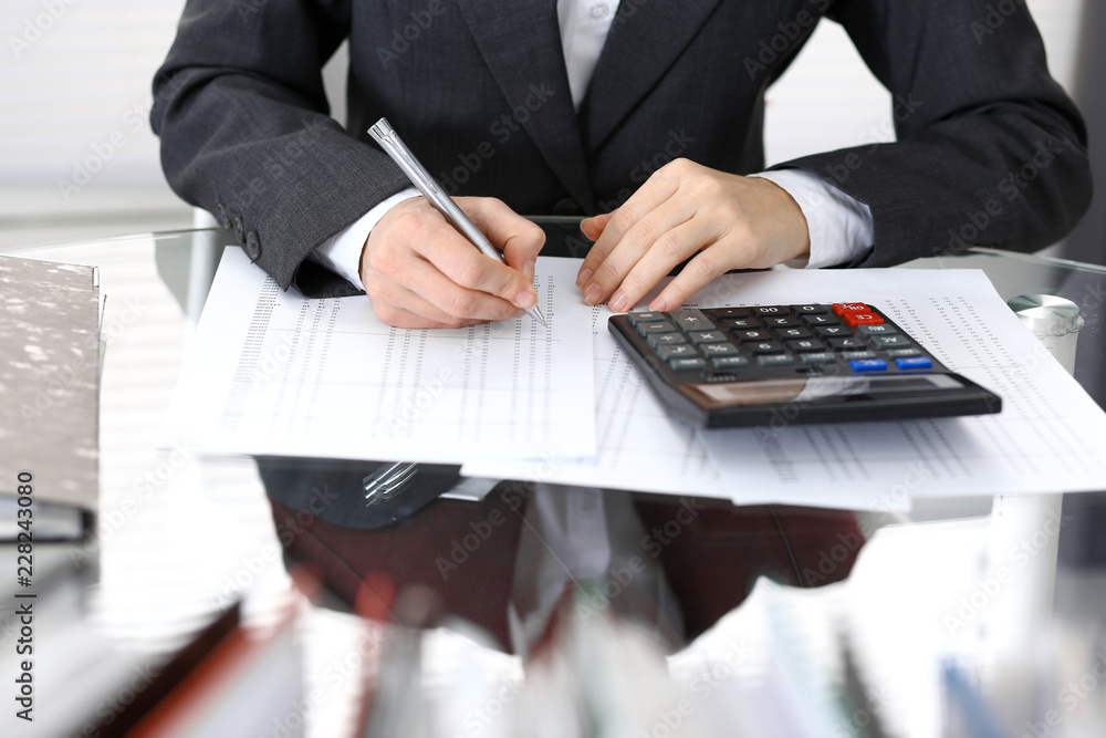 Bookkeeper woman or financial inspector making report, calculating or ...