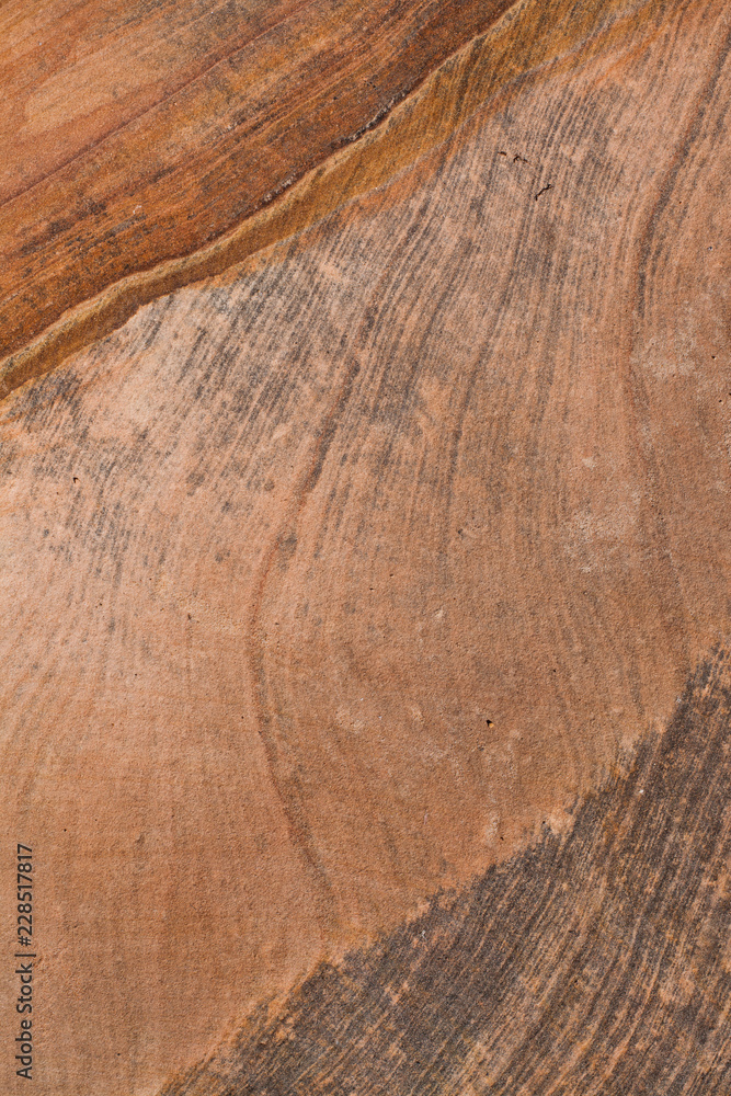 Vertical and diagonal lines ripple through this sandstone showing the ...