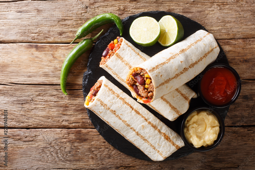 Mexican popular grilled burrito snack with beef and vegetables and with ...