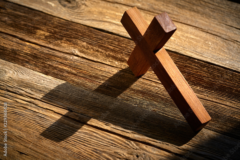 Christian cross on wood over wooden Stock Photo | Adobe Stock
