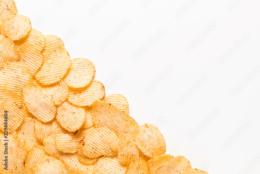 Crispy potatoes chips isolated on white background. Food background ...