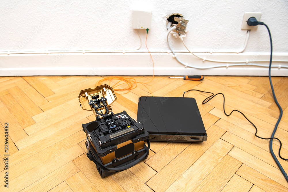 Foto de Stock FTTH fiber installation at home with new arc clad ...