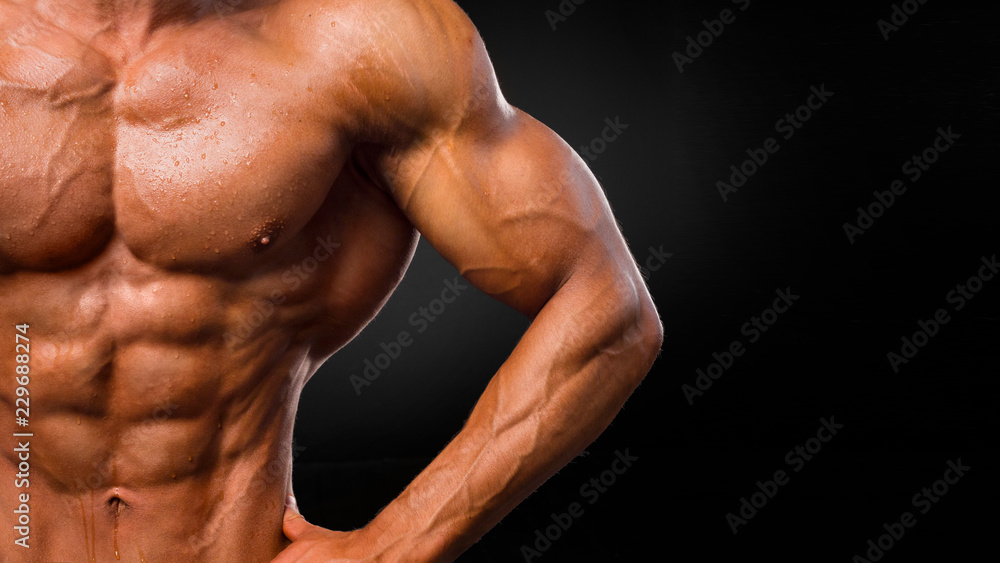 Stock-Foto „Young handsome sportsman bodybuilder weightlifter with an ...