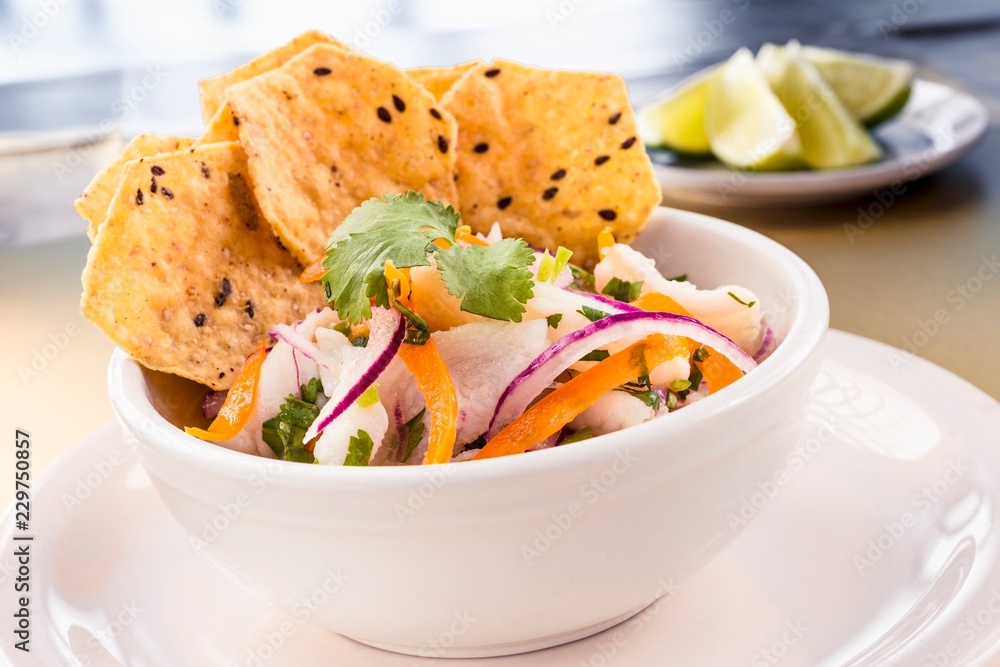 Foto de Stock Corvina fish marinated with lemon, red onions, yellow ...