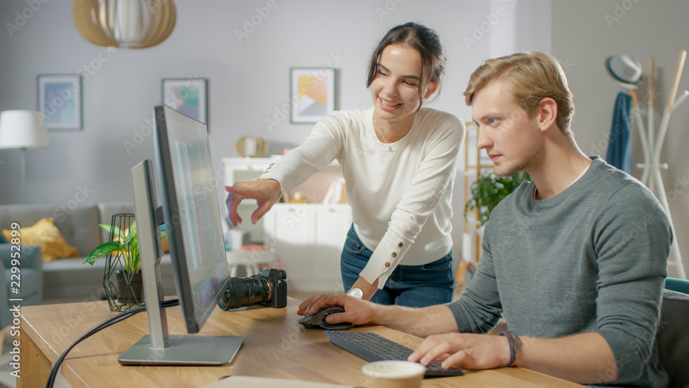 Male and Female Professional Editors Talk while Working in Photo ...