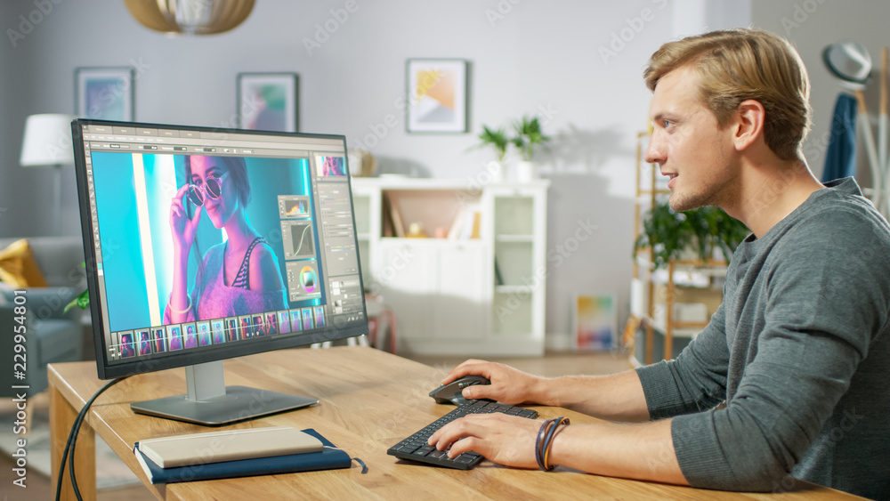 Professional Photographer Works in Photo Editing App / Software on His ...