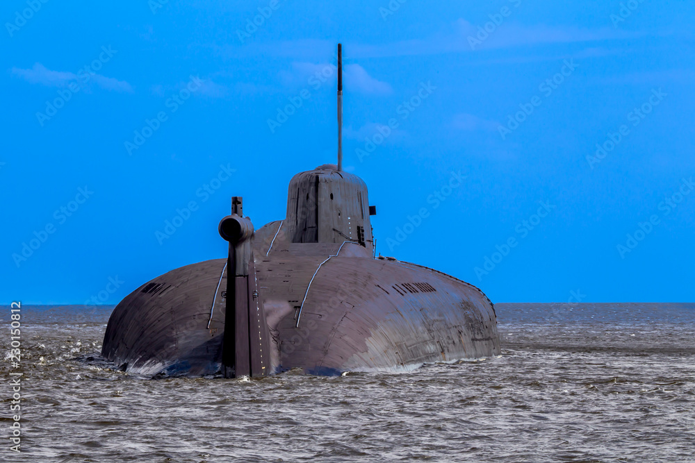 The submarine goes beyond the horizon. Military ships. Fairway for ...