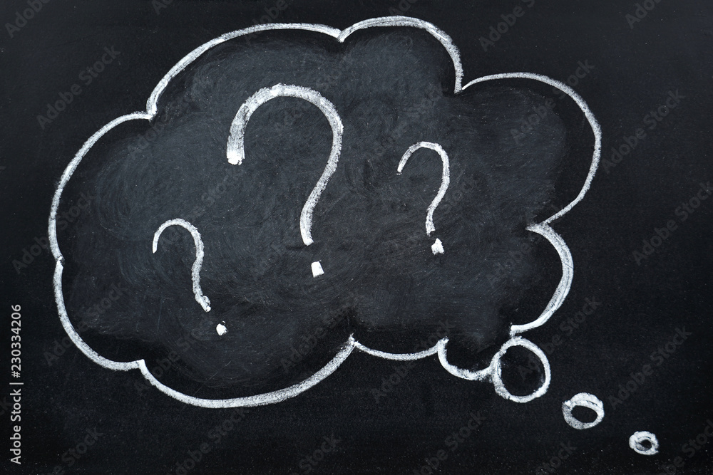 Chalk hand drawing question marks in thought bubble on blackboard Stock ...