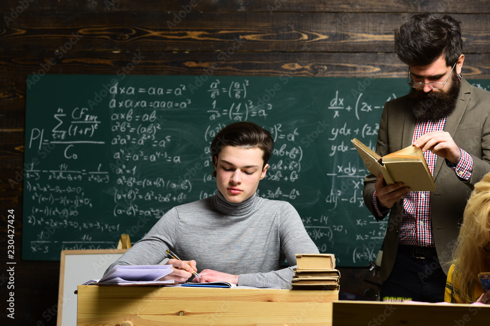 Teacher puts marks sends feedbacks on email with laptop computer ...