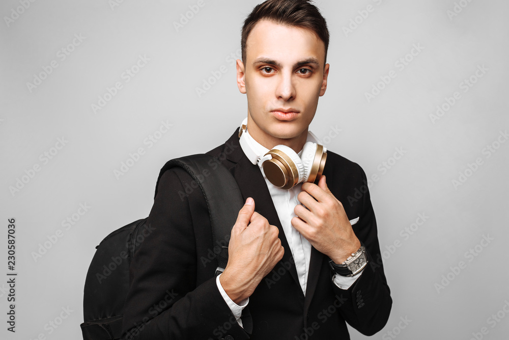 Portrait of a handsome young business man, male, in a classic black ...