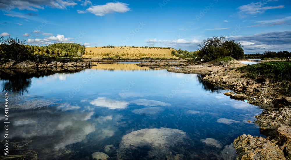 Sandy hills. Lake in the Sandy canyon. Warm colors background. Yellow ...