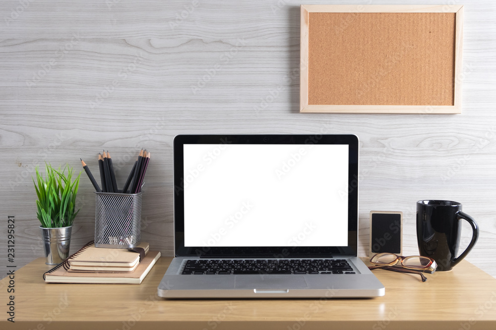 Mockup white screen laptop on table. workspace with blank screen laptop ...