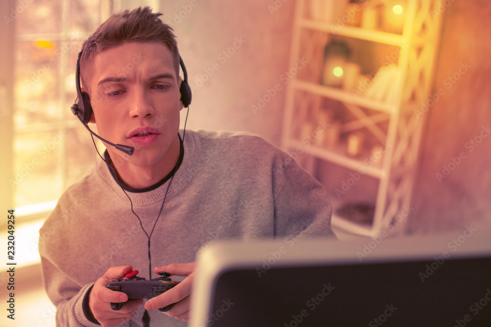 Attentive adolescent chilling at home with his computer Stock Photo ...
