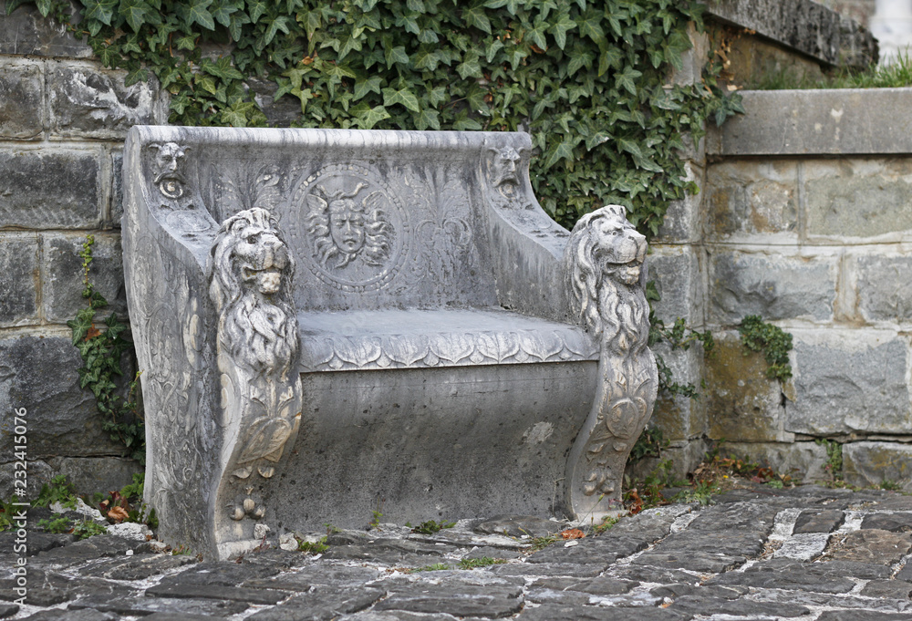 Strong support: stone sculpted throne in the garden of Peles Palace ...
