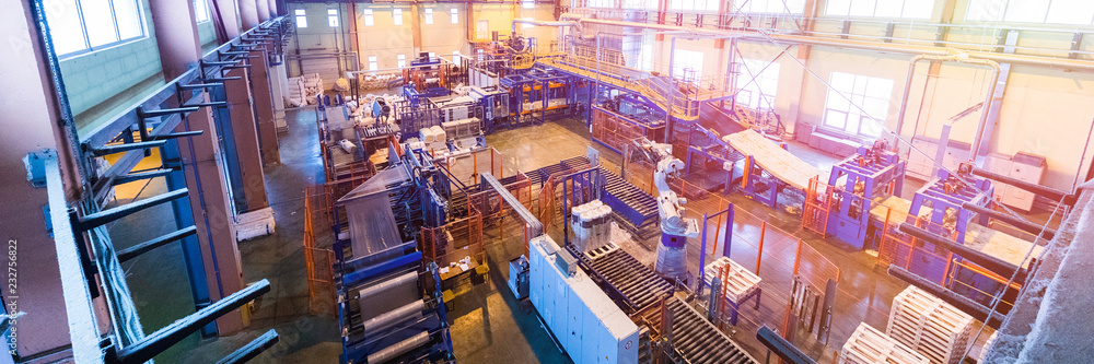 Fiberglass production industry equipment at manufacture background ...