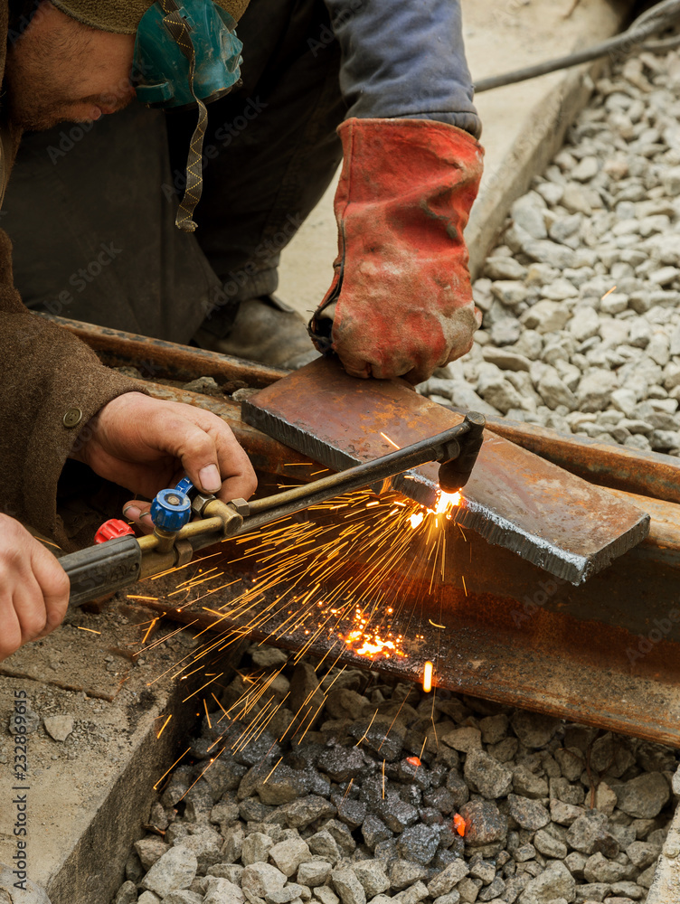 Stock-Foto „Repair of iron tram line. Installation of railway rails for ...
