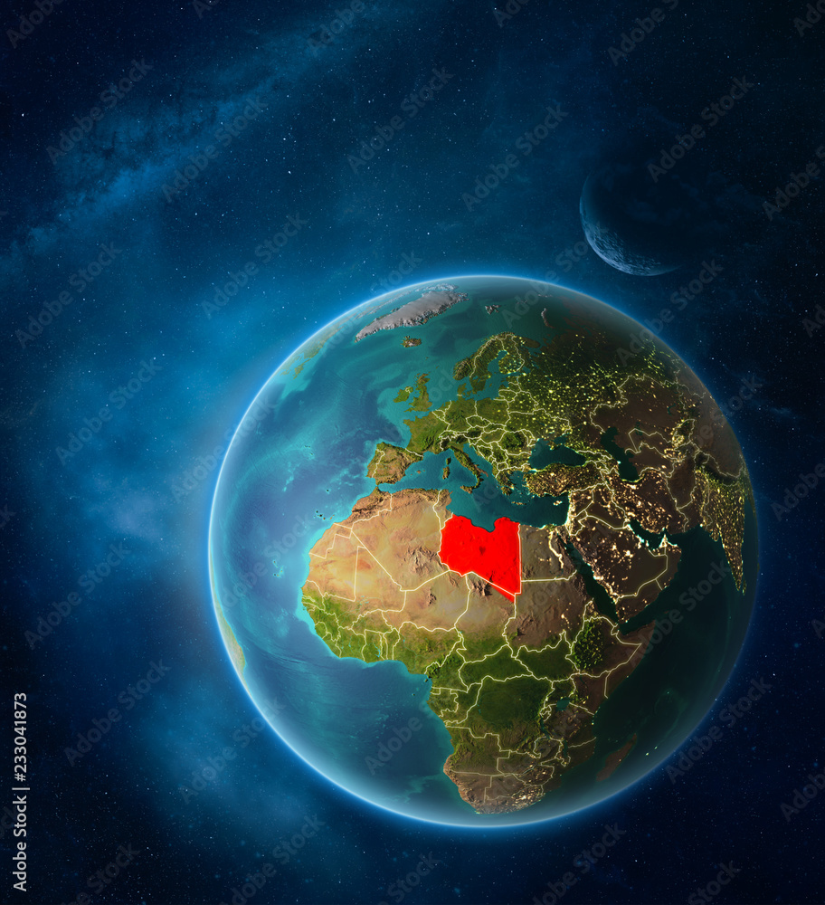 Planet Earth with highlighted Libya in space with Moon and Milky Way. Visible city lights and ...