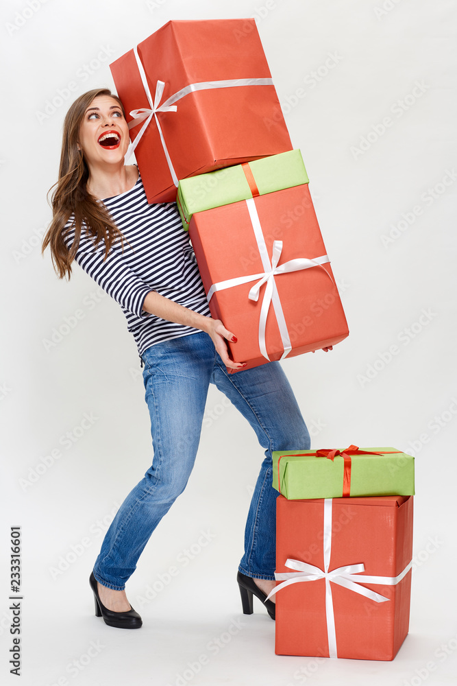 happy woman lifting heavy big gift boxes. Stock Photo | Adobe Stock