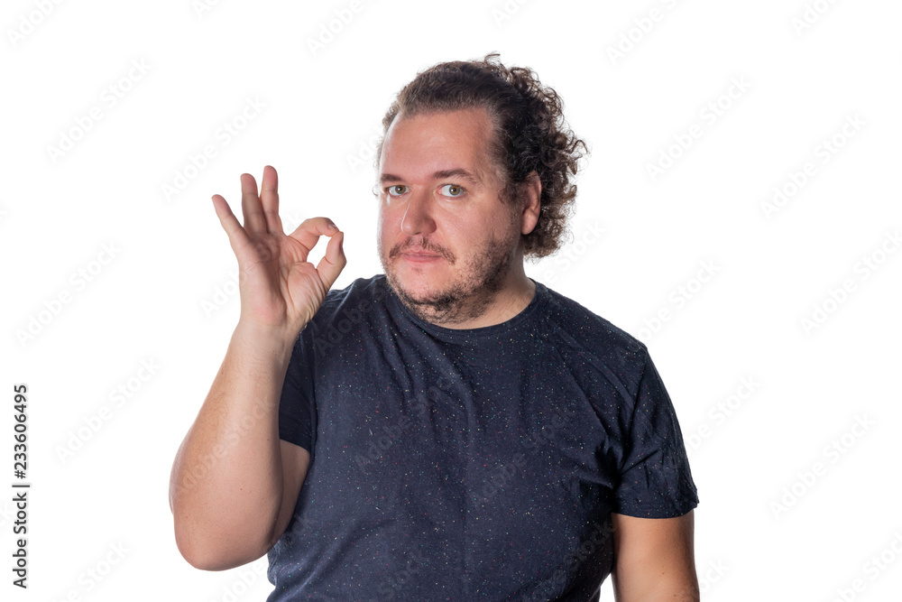 Fat funny man shows ok sign, demonstrates that everything is fine ...