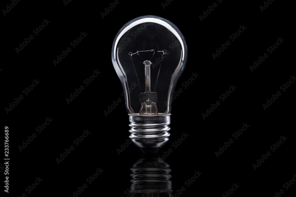 Light bulb on black background Stock Photo | Adobe Stock