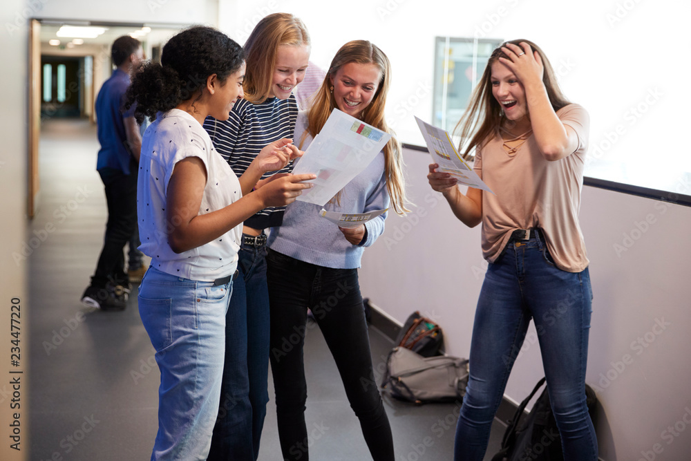 Excited Female Teenage High School Students Celebrating Exam Results In ...