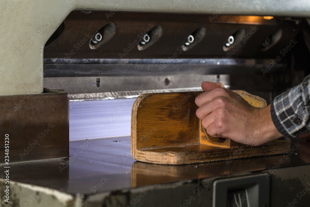 Stock-Foto „Front view of a paper guillotine in commercial printing ...