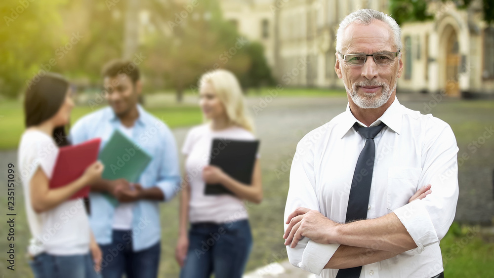 Successful professor posing with hands crossed, university education ...